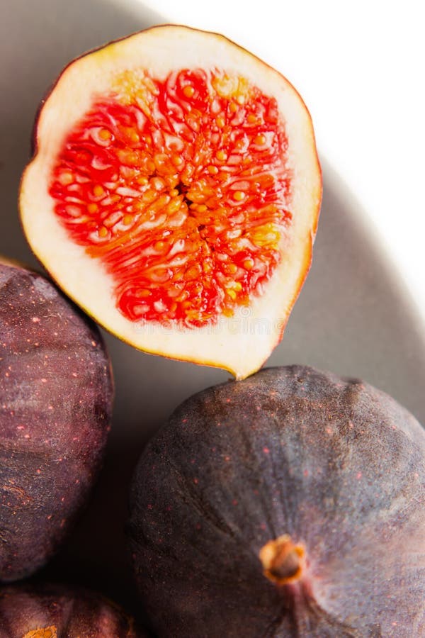 Fresh Figs on Grey Plate. Fruit with Half Isolated on White. Stock ...