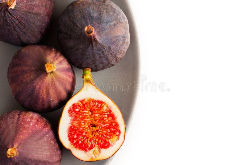 Fresh Figs On Grey Plate. Fruit With Half Isolated On White. Stock ...