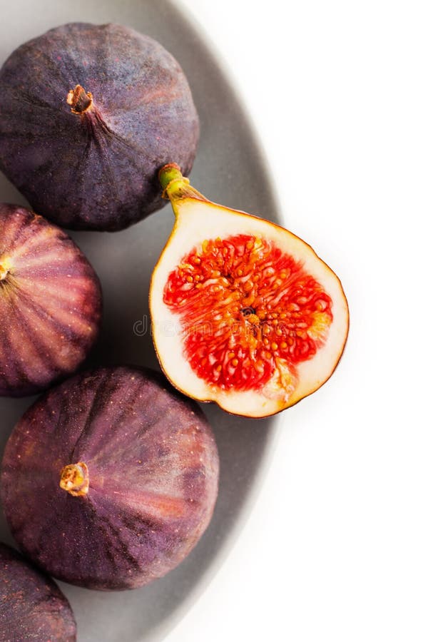 Fresh Figs on Grey Plate. Fruit with Half on White. Stock Photo - Image ...