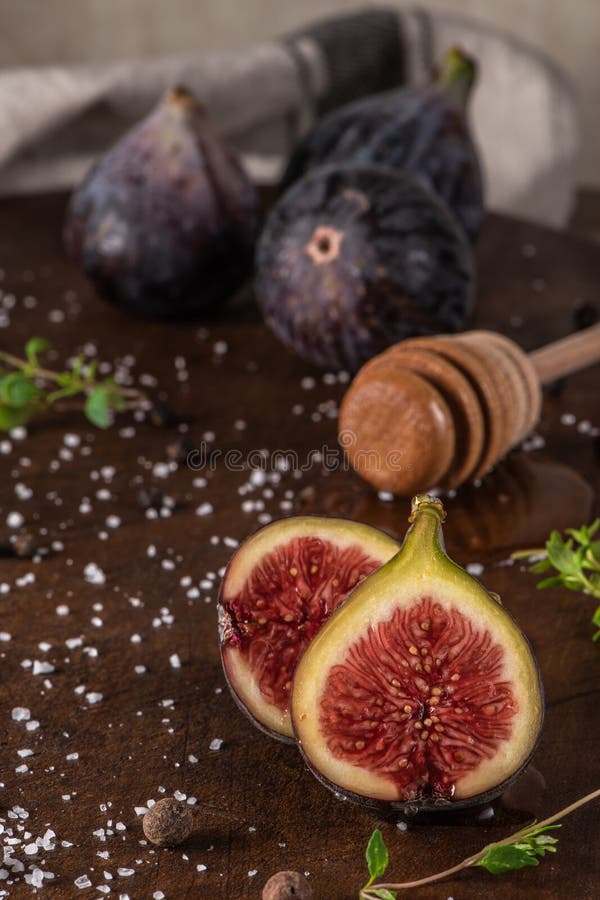 Fresh Figs. Whole Figs and Sliced in Half Figs on Wooden Cutting Stock ...