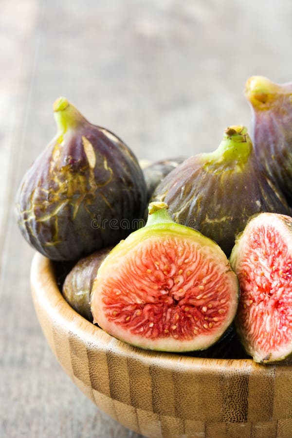 Fresh figs on wooden table stock image. Image of fruit - 98151257