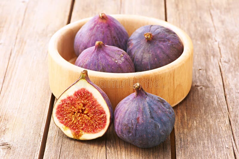 Fresh figs on wooden table stock image. Image of exotic - 49207581