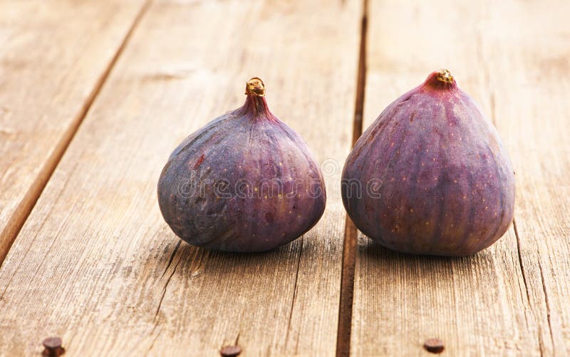 Fresh figs on wooden table stock photo. Image of healthy - 49690278