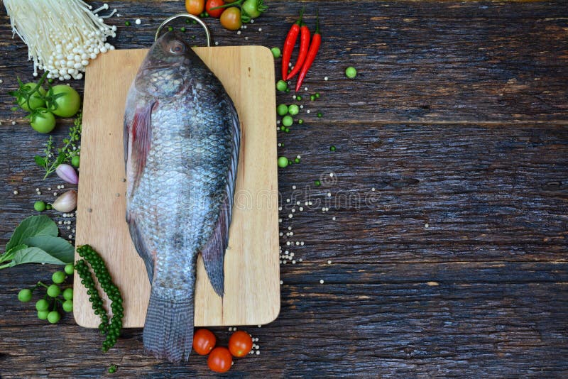 Fresh Fish with Aromatic Herbs, Spices, Salt with Lemon with Chopping ...
