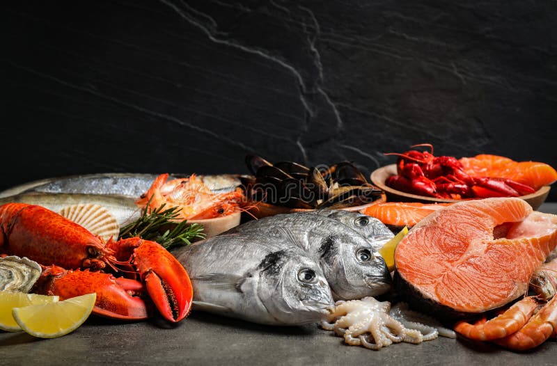 Fresh Fish and Different Seafood on Table Stock Image - Image of fruit ...