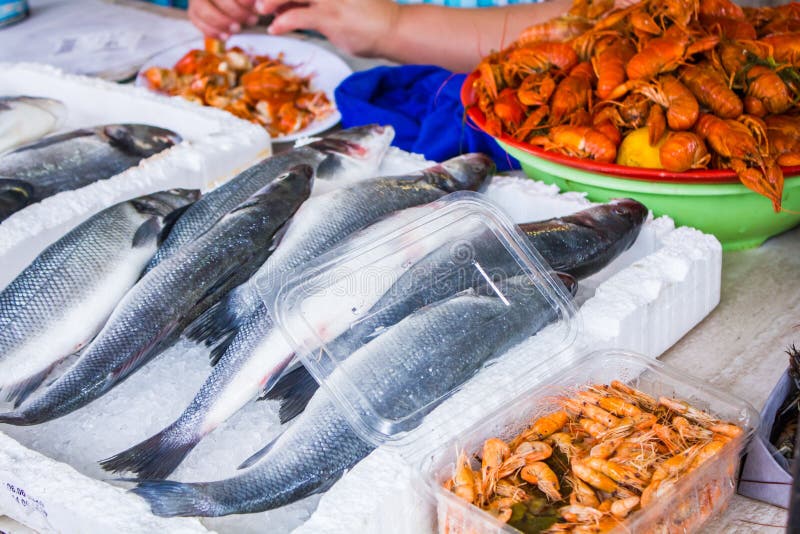 Fresh Fish in Different Sizes Laying on a Table Stock Image - Image of ...