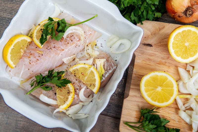 Fresh Fish, Raw Cod Fillets with Addition of Herbs and Lemon Stock ...