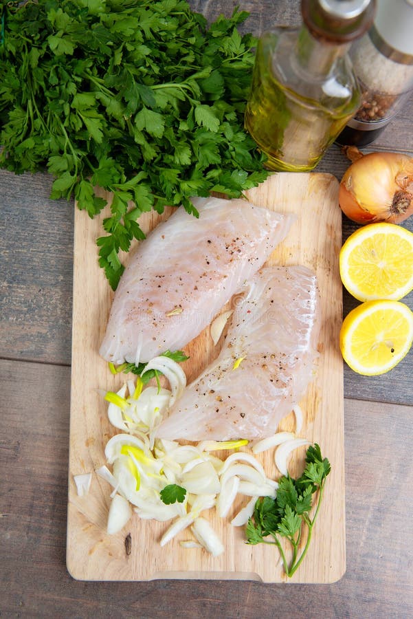 Fresh Fish, Raw Cod Fillets with Addition of Herbs and Lemon Stock ...