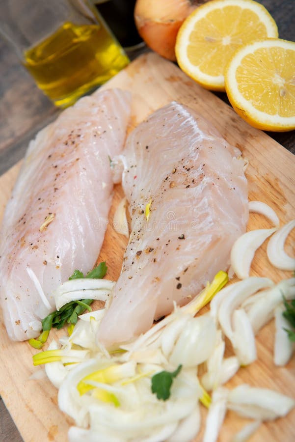 Fresh Fish, Raw Cod Fillets with Addition of Herbs and Lemon Stock ...