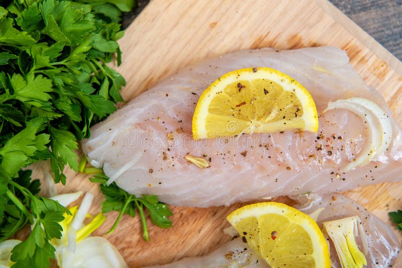 Fresh Fish, Raw Cod Fillets with Addition of Herbs and Lemon Stock ...