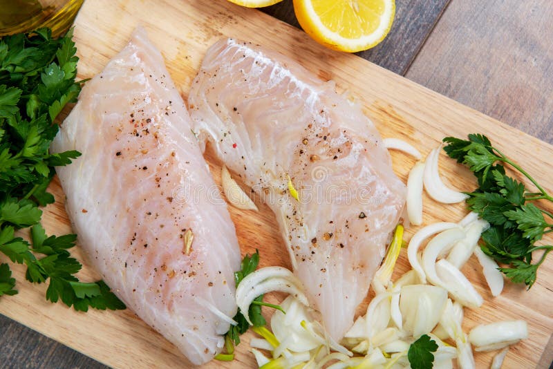 Fresh Fish, Raw Cod Fillets with Addition of Herbs and Lemon Stock ...