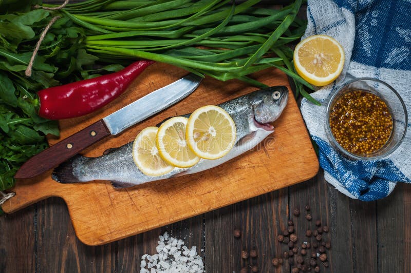 Fresh Fish Ready To Be Cook on a Wooden Table Stock Image - Image of ...