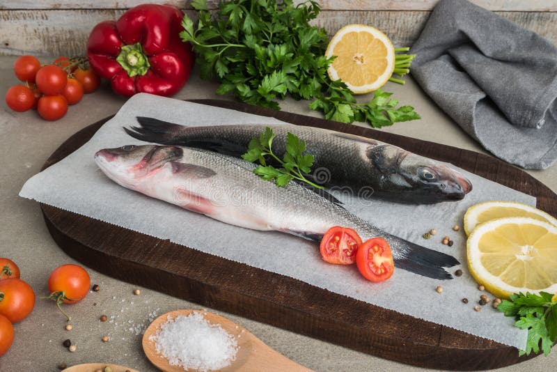 Fresh Fish Sea Bass on Wooden Table Stock Image - Image of seafood ...