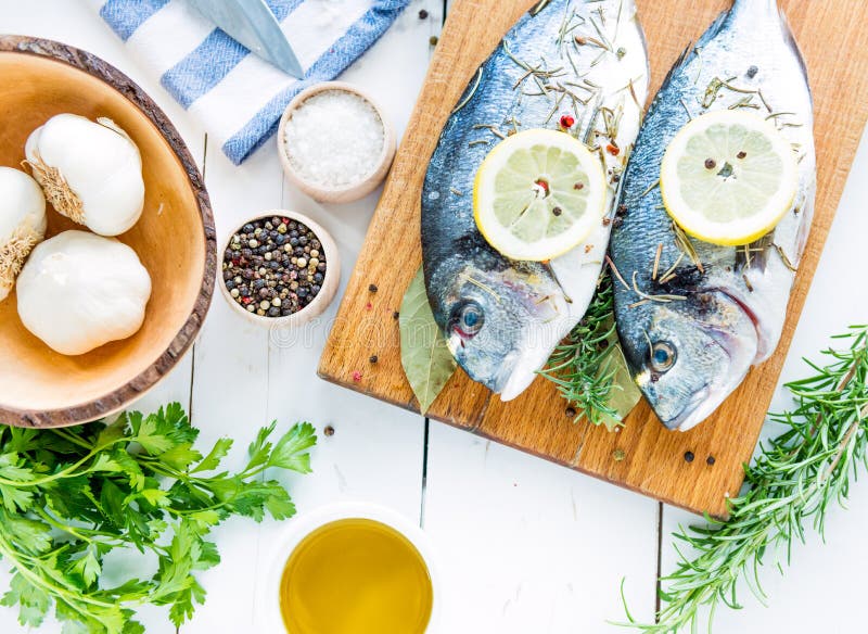 Fresh Fish Sea Bream Dorada on a White Table Stock Photo - Image of ...