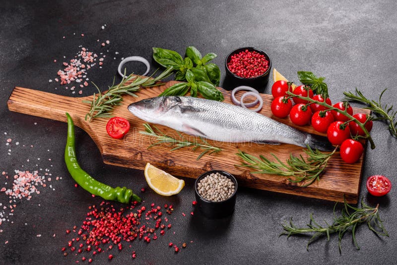 Fresh Fish Seabass and Ingredients for Cooking. Raw Fish Seabass Stock ...