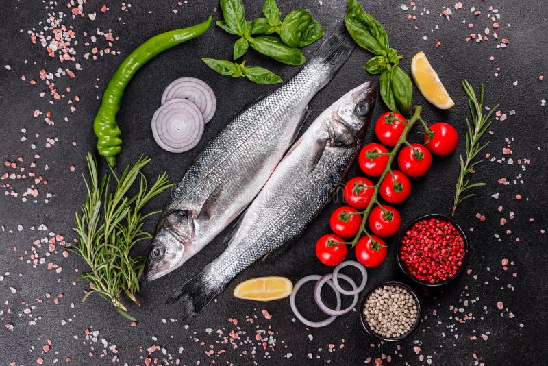 Fresh Fish Seabass and Ingredients for Cooking. Raw Fish Seabass Stock ...