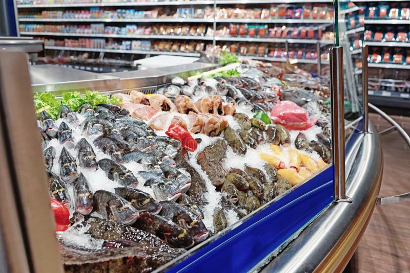 Fresh Fish and Seafood on Iced Market Display, Toned Stock Photo ...