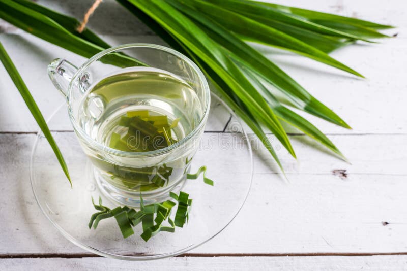 Fresh Fragrant Pandan Tea and Leaves on Wood Background Stock Photo ...