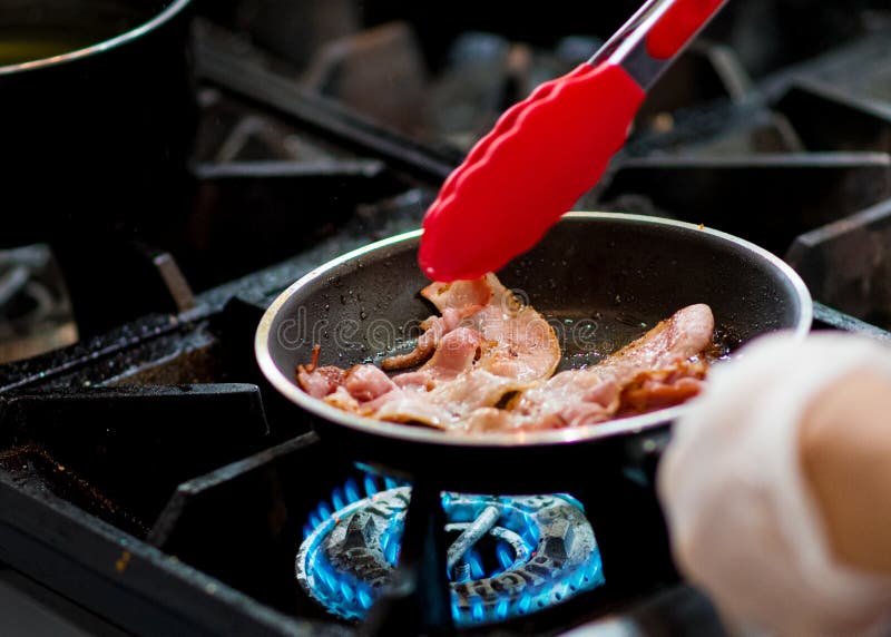 Fresh Fried Bacon in a Pan, Chef Cooking in the Kitchen Stock Image ...