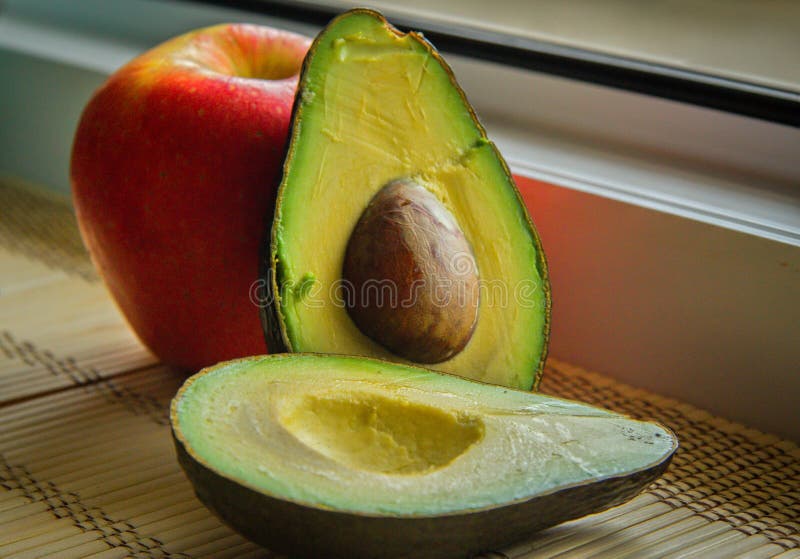 Avocado Cut To Halves and Apple Stock Image - Image of fresh, food ...