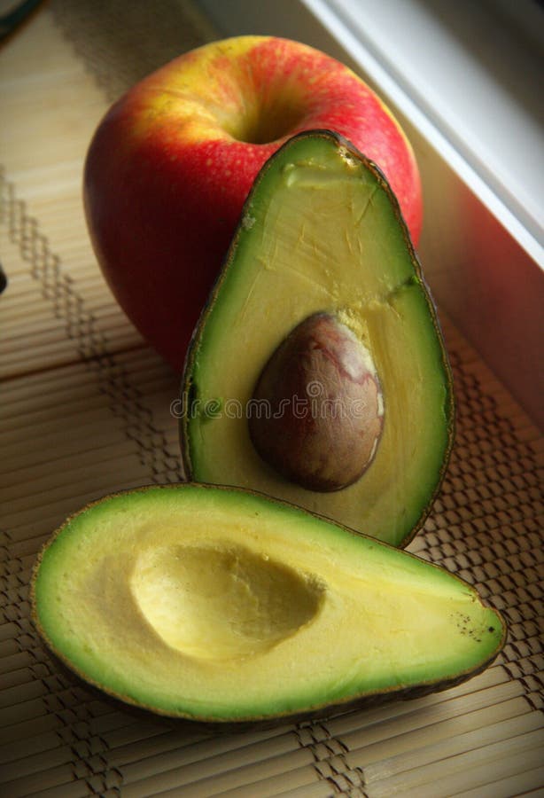 Avocado Cut To Halves and Apple Stock Photo - Image of healthy ...