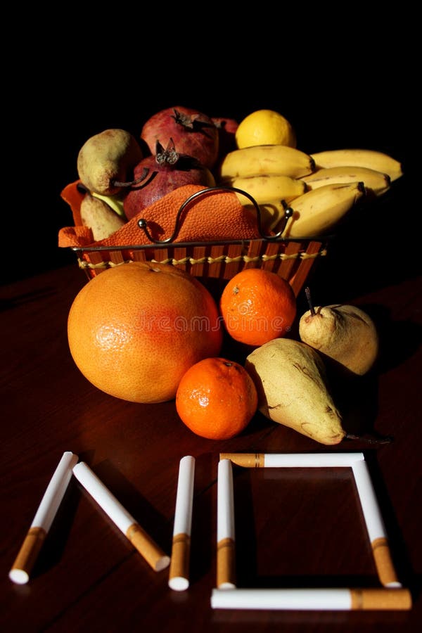 Fresh fruit and cigarettes stock photo. Image of agriculture - 66654340
