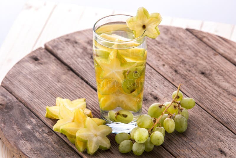 Fresh Fruit Flavored Infused Water Mix of Starfruit and Grap Stock ...