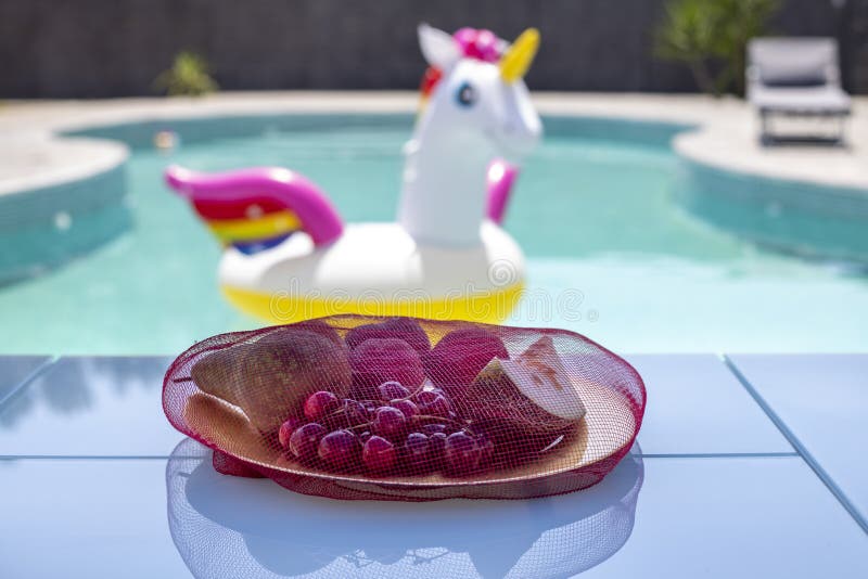 Fresh Fruit Tray Covered with Mesh for Insects, Waiting by the Pool ...
