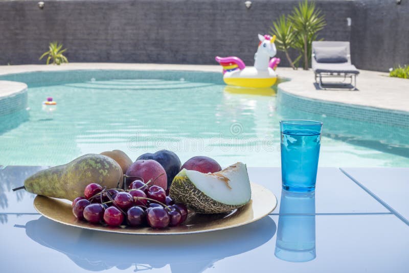 Fresh Fruit Tray Covered with Mesh for Insects, Waiting by the Pool ...