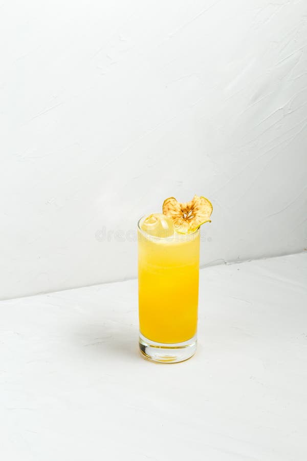 Yellow Alcohol Cocktail with Fruit Ice Crush and Carambola Slice Stock ...