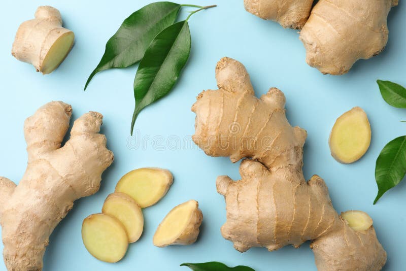 Fresh Ginger with Green Leaves on Pale Light Blue Background, Flat Lay ...