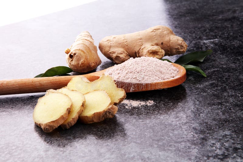 Fresh Ginger Root and Ground Ginger Spice on Dark Background Stock ...