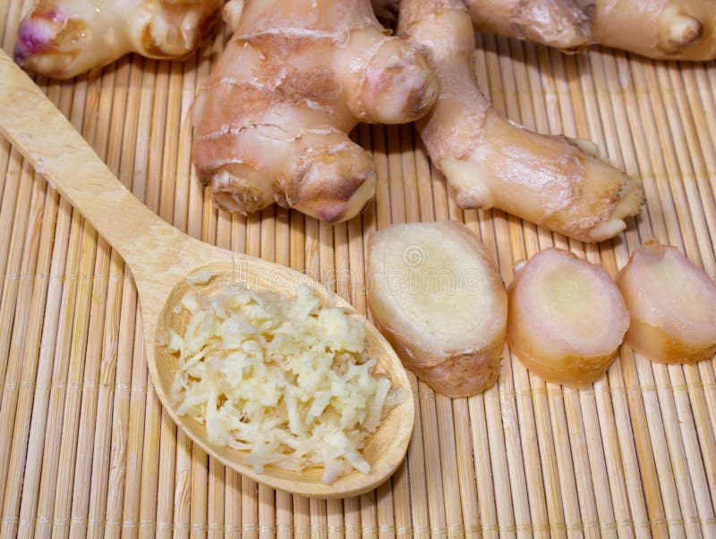 Fresh Ginger Root and Spoon with Grated Ginger. a Healthy Product, for ... Fresh Ginger Root and Spoon with Grated Ginger. a Healthy Product, for ...