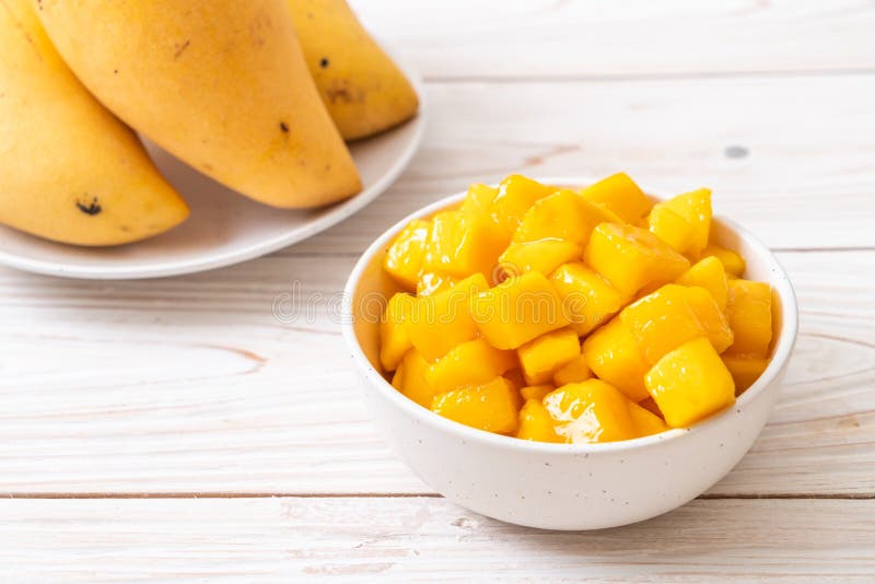 Fresh and golden mangoes stock photo. Image of diet - 141874220