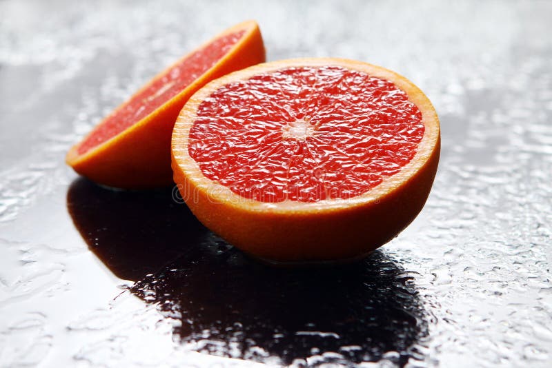 Pink Grapefruit Slices on Plate Stock Image - Image of beverage ...