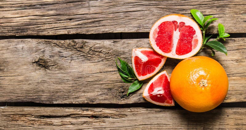 Fresh Grapefruit with Leaves. on Wooden Table. Stock Photo - Image of ...