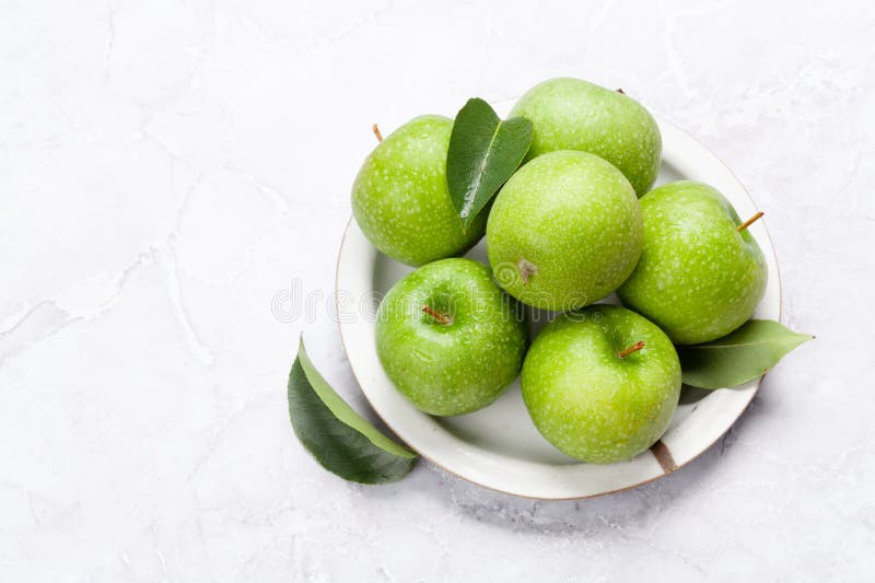 Fresh Green Apples on Plate on Stone Table Stock Photo - Image of table ...