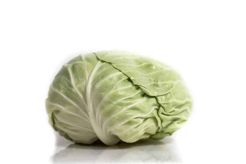 A Fresh Green Cabbage with Tightly Packed Leaves Forms a Compact, Round ...