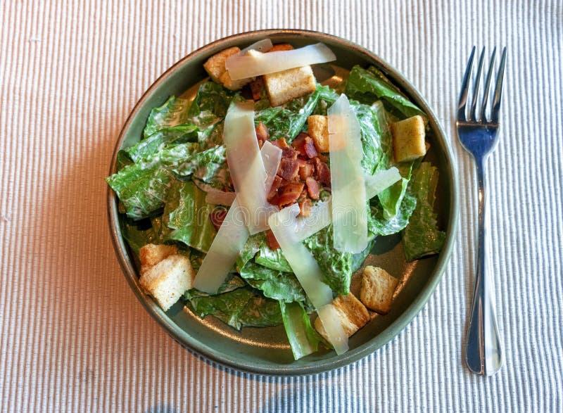 Fresh Green Caesar Salad with Bacon and Cheese on Top Stock Photo ...