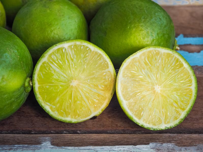 Fresh Green Lemon On Wooden Table Stock Image - Image of ripe ...
