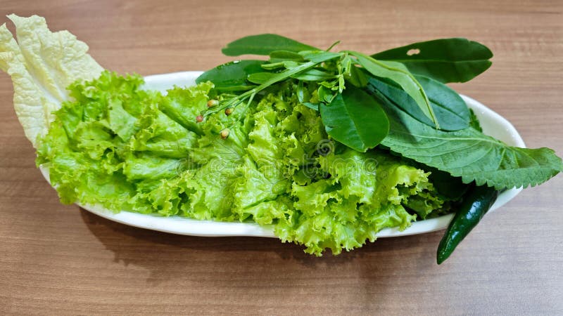 Fresh Green Lettuce and Assorted Vegetables on a Wooden Table in a ...