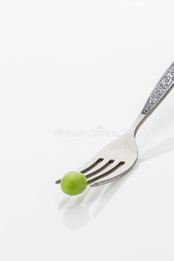 Fresh Green Pea on Fork Closeup, on White Stock Photo - Image of ...