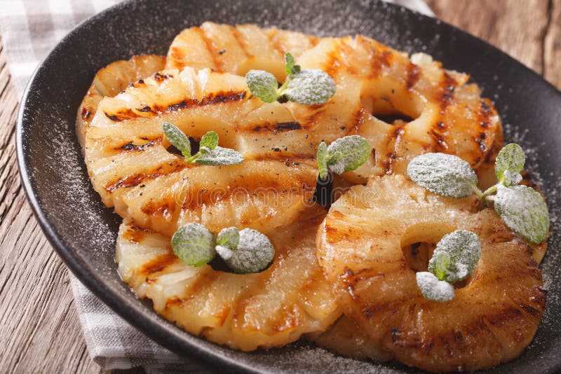 Fresh Grilled Pineapple Rings with Mint Close Up on a Plate. Horizontal ...