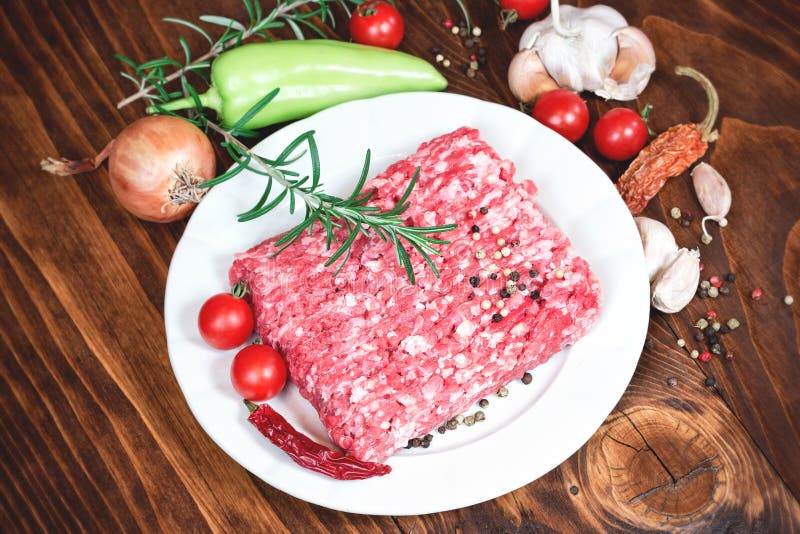 Fresh Ground Beef Meat with Seasonings on White Plate Stock Image ...