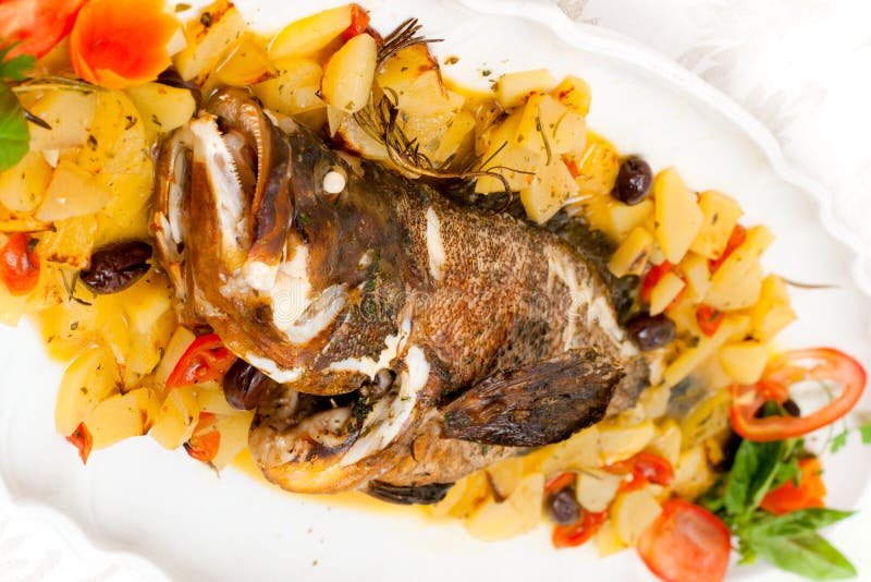 Fresh Grouper with Potatoes and Tomatoes. Stock Image - Image of ...