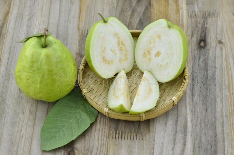 Fresh Guava Cut Half on Wooden Table Stock Photo - Image of gastronomy ...