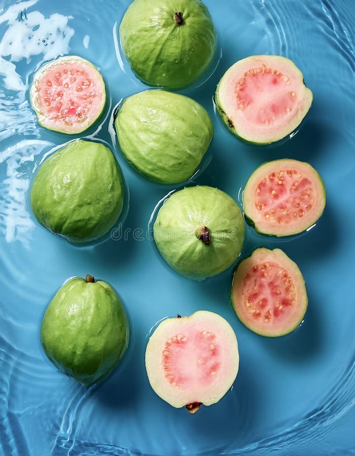 Fresh Guava Fruit Whole and Slices Floating in a Clear Blue Water Stock ...