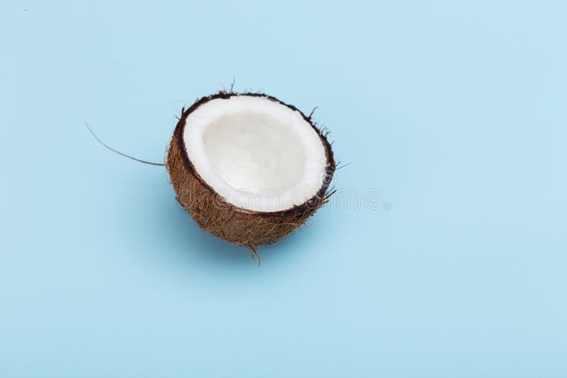 Fresh Half Natural Coconut on Blue Background Stock Image - Image of ...