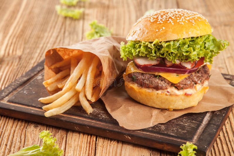 Fresh Hamburger with Fries Served on Wood Stock Image - Image of plate ...