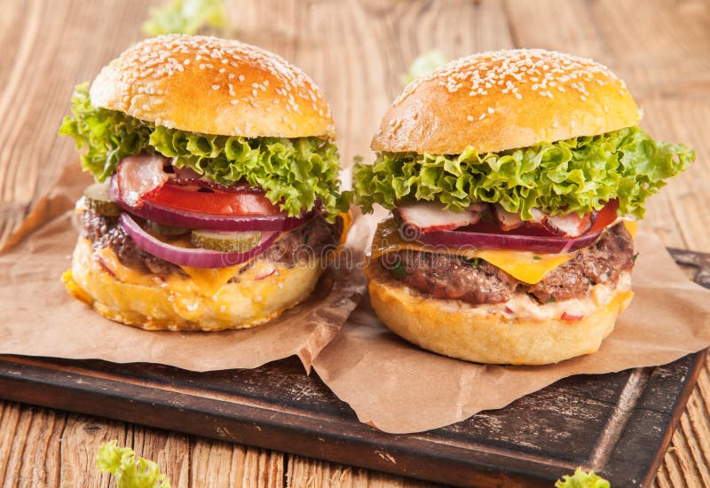 Fresh Hamburger Served on Wood Stock Image - Image of onion, cheddar ...